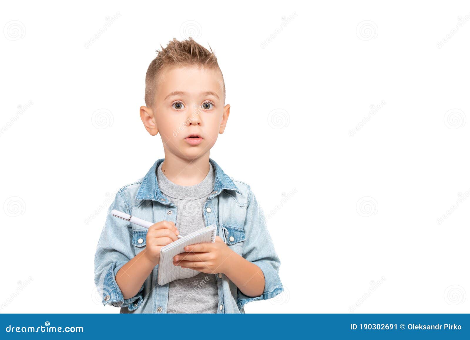 Cute Attentive Little Boy Looking at Camera Writing Something in Her ...