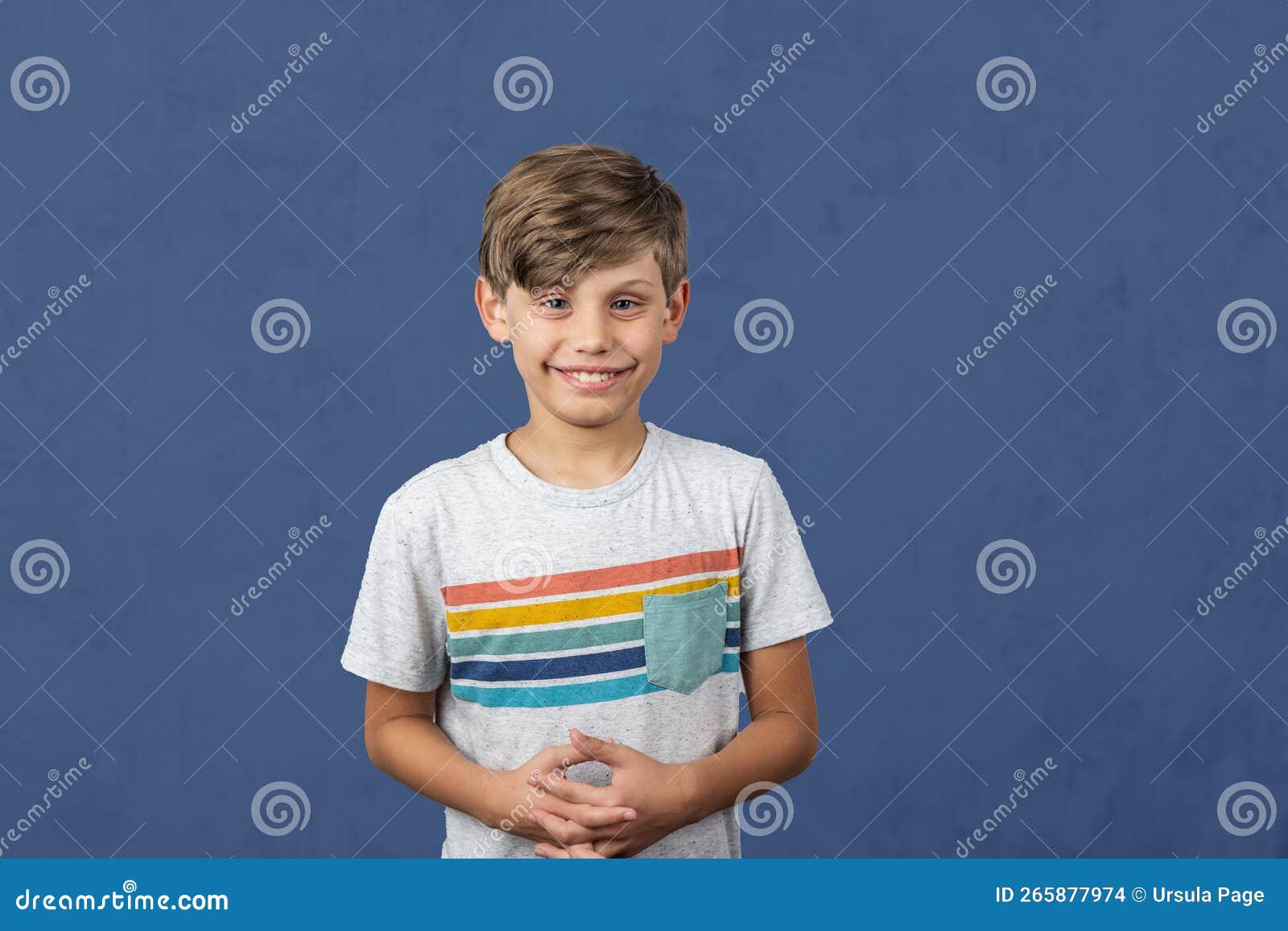 A Cute Autistic Elementary School Boy on a Blue Background with Copy ...