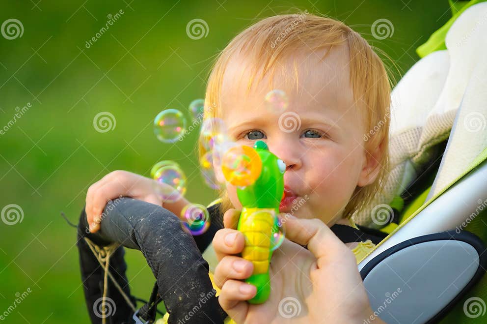 Cute Baby blowing bubbles stock image. Image of toddler - 23555289
