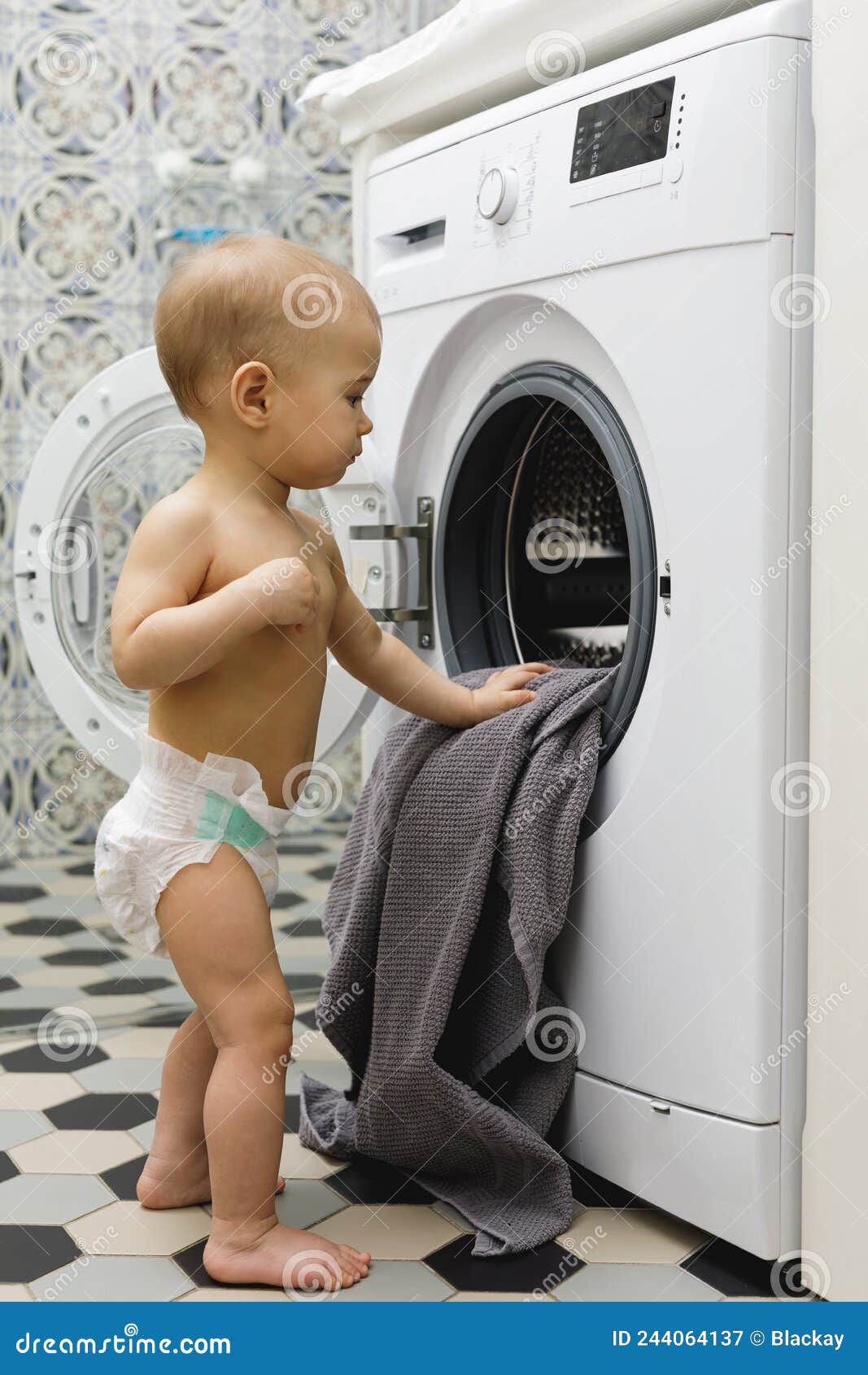 Cute Baby Boy is Looking Inside the Washing Machine Stock Image - Image ...
