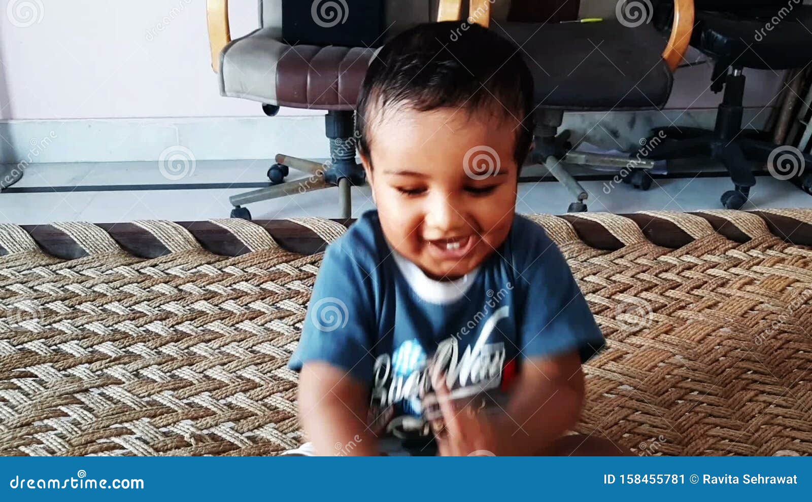 Cute Baby Boy Playing he is Sitting on Cot. Stock Video - Video of ...