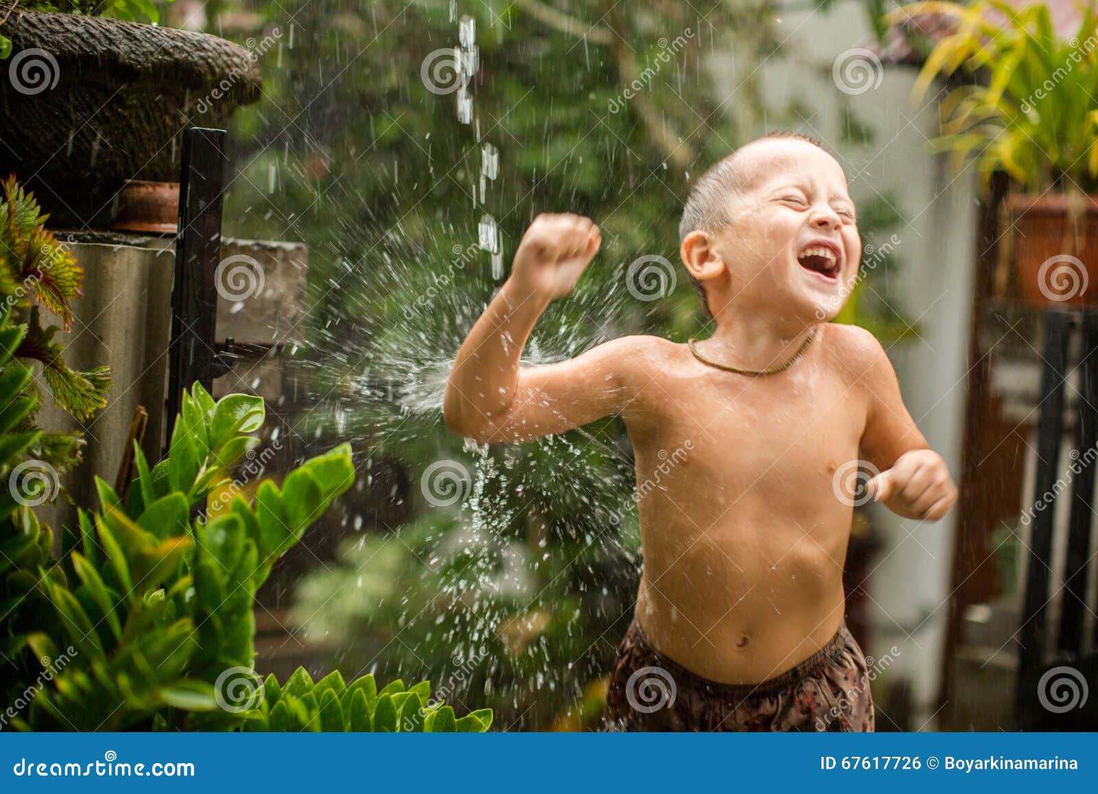 Cute Baby Boy Playing Under the Rain Stock Photo - Image of outside ...