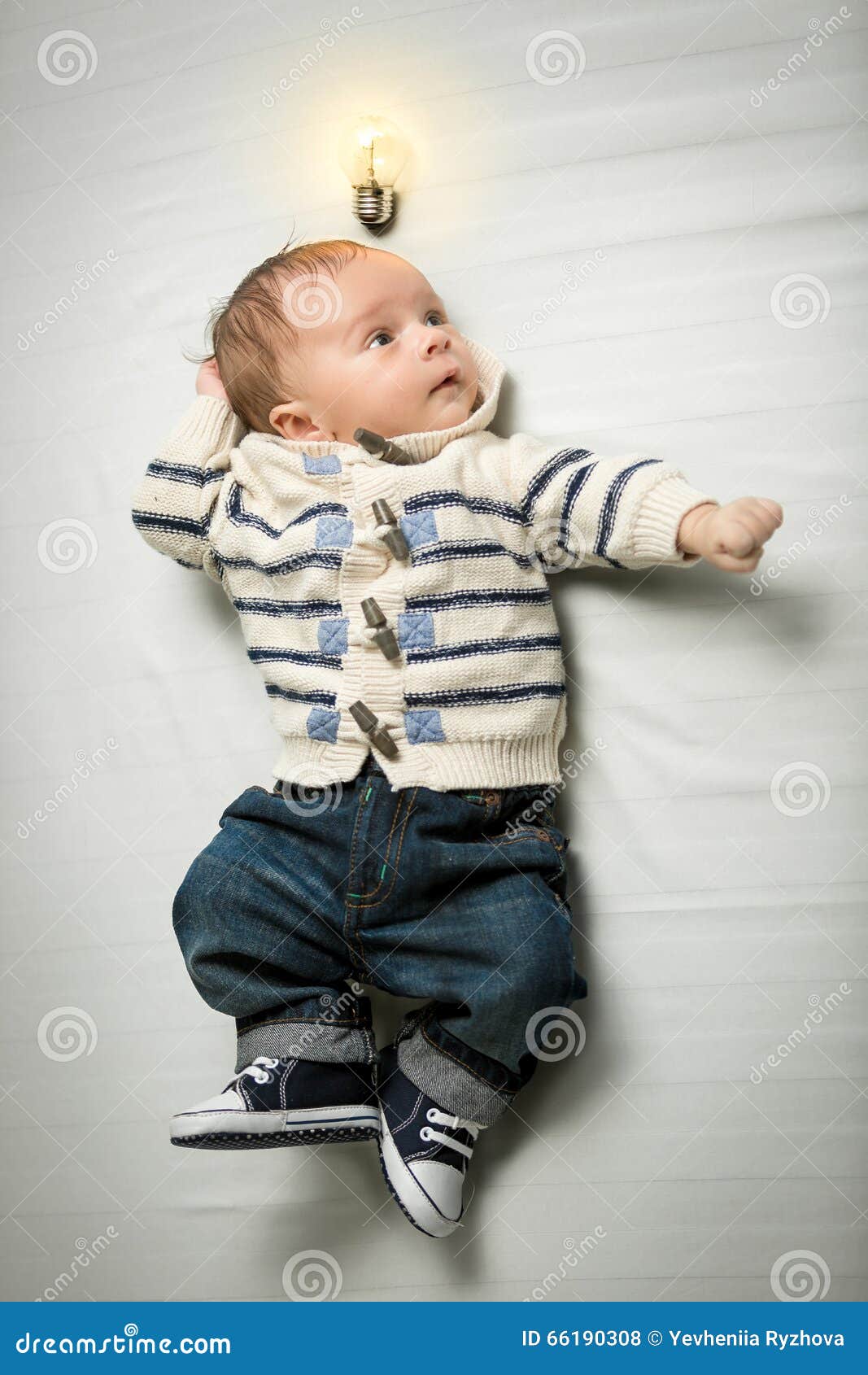 Cute Baby Boy Posing on Bed with Glowing Light Bulb Overhead Stock ...