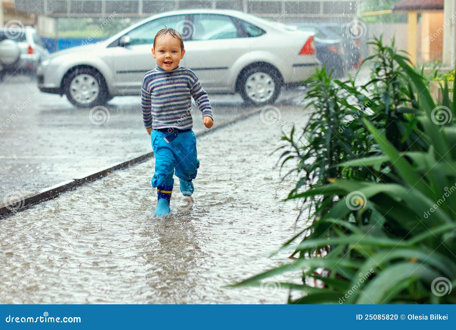 Cute Baby Boy Running Under the Rain Stock Photo - Image of cloudburst ...