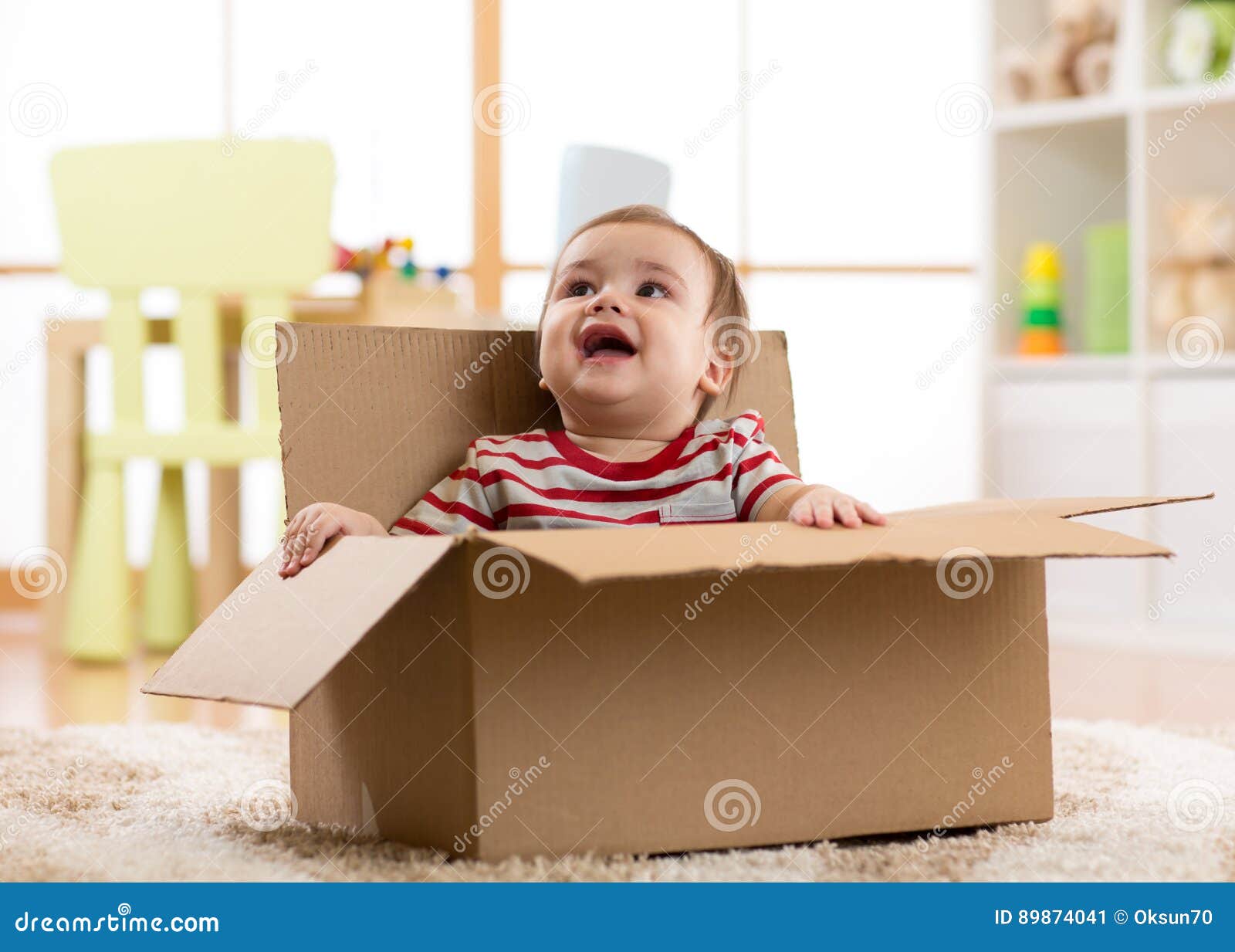 Cute Baby Boy Sitting Inside Brown Cardboard Box Stock Image - Image of ...