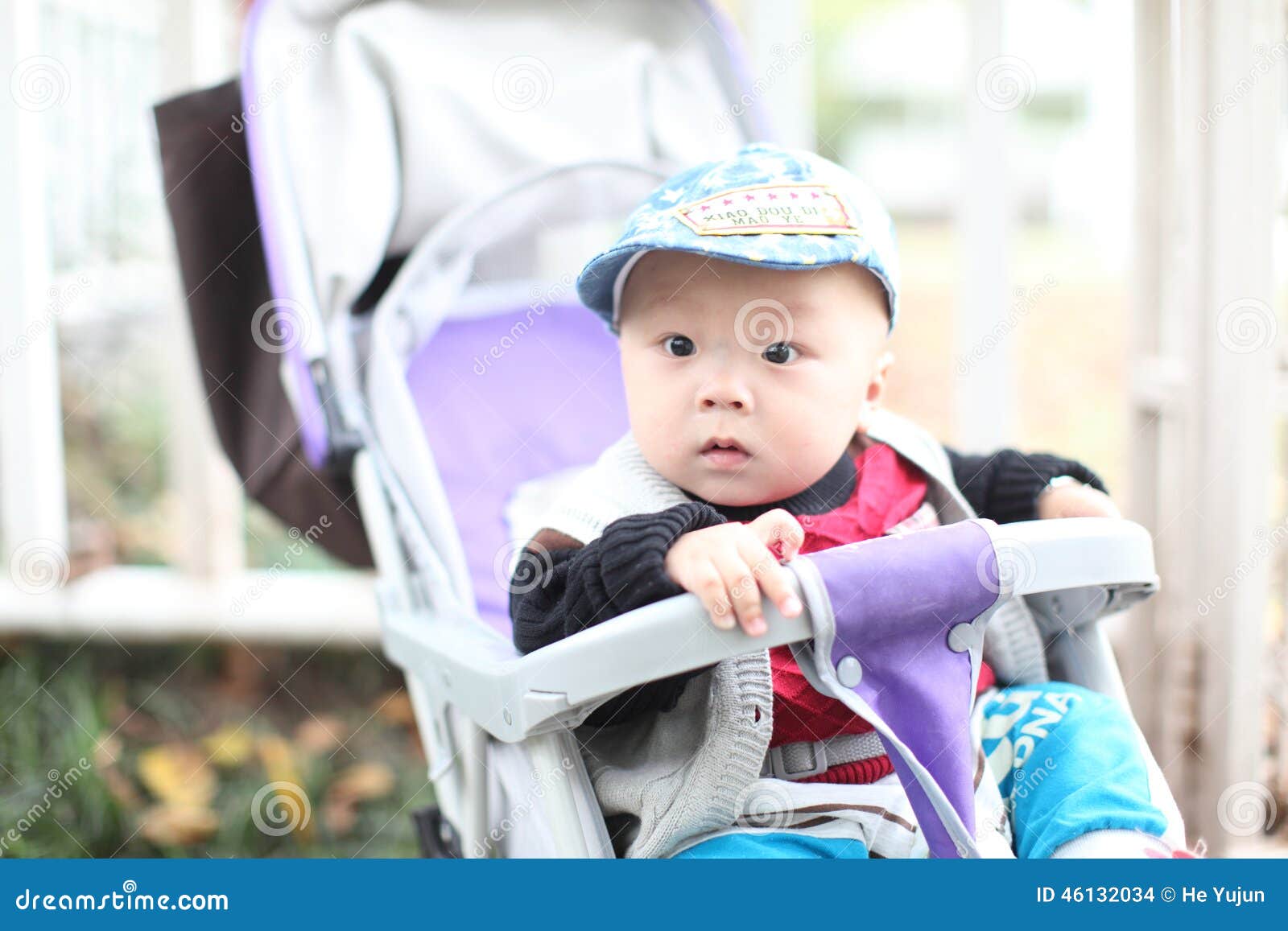 Cute Baby Boy Sitting in Stroller Stock Photo - Image of outdoors ...