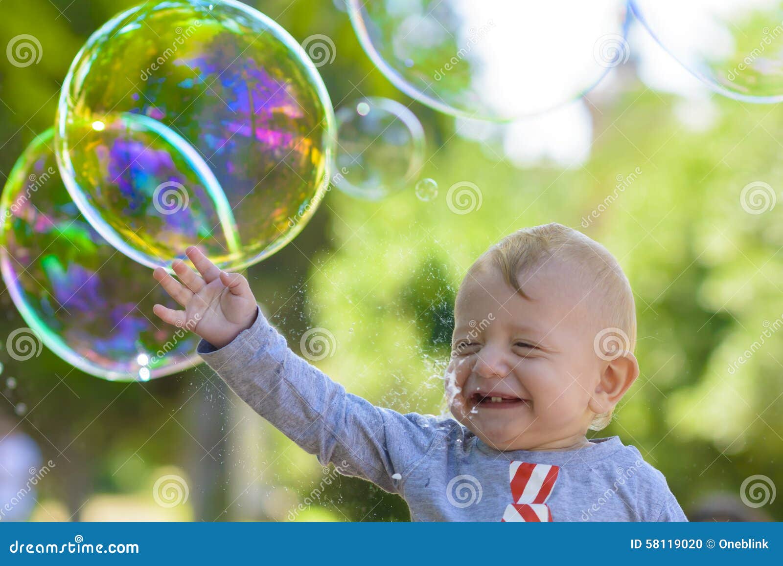 Cute Baby Catching Soap Bubbles Stock Photo - Image of blond, lovely ...