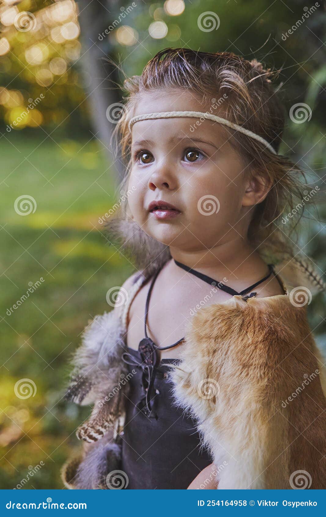 Cute Baby Dressed in the Clothes of Primitive People Stock Photo ...