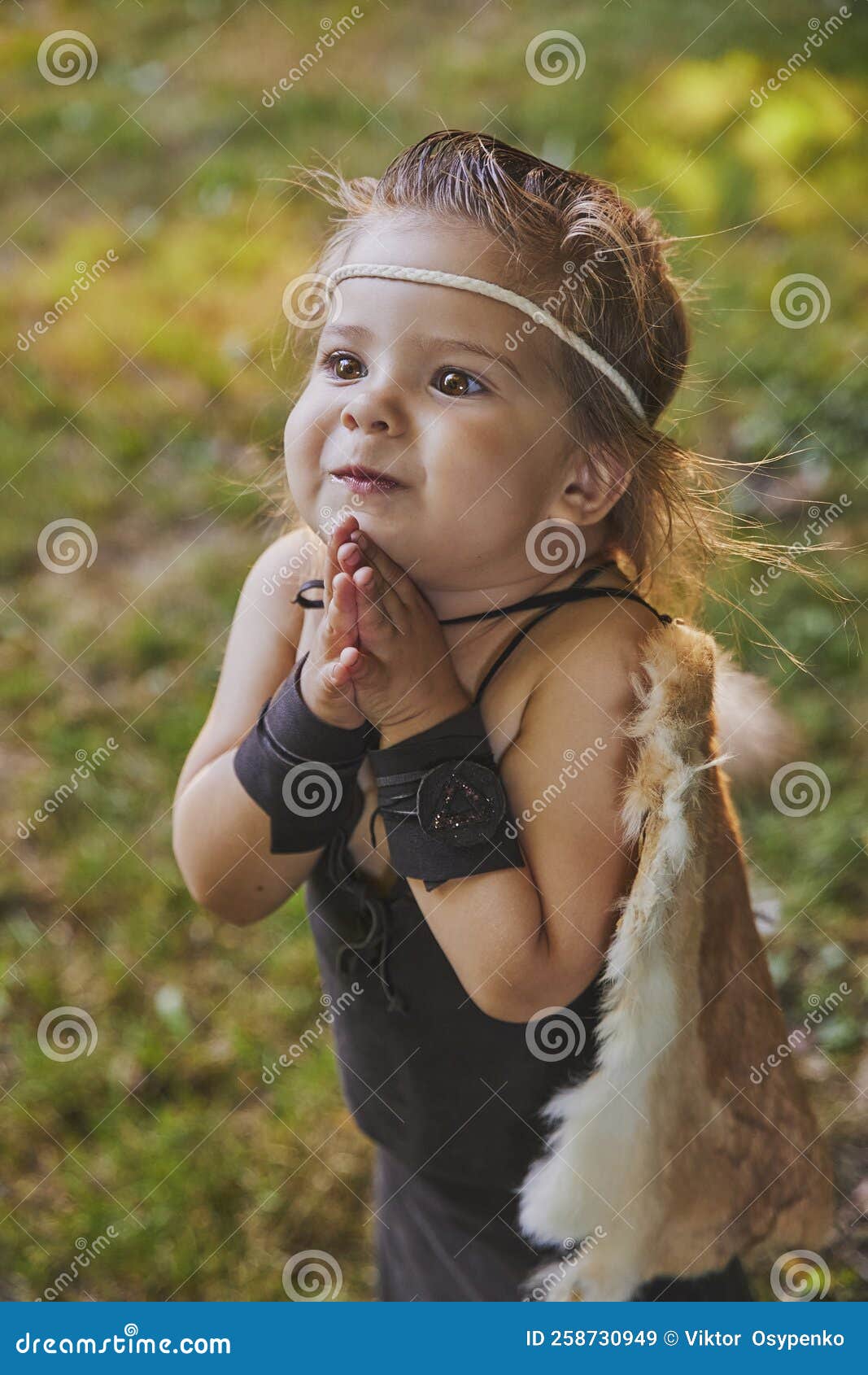Cute Baby Dressed in the Clothes of Primitive People Stock Image ...