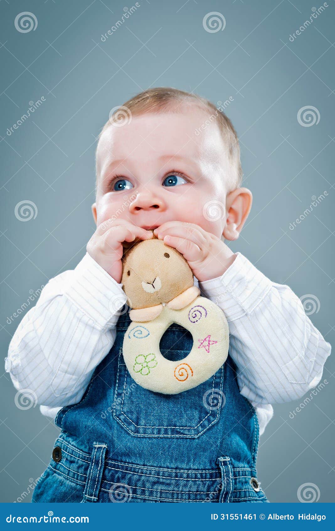 Cute Baby Eating a Toy stock image. Image of cute, little - 31551461