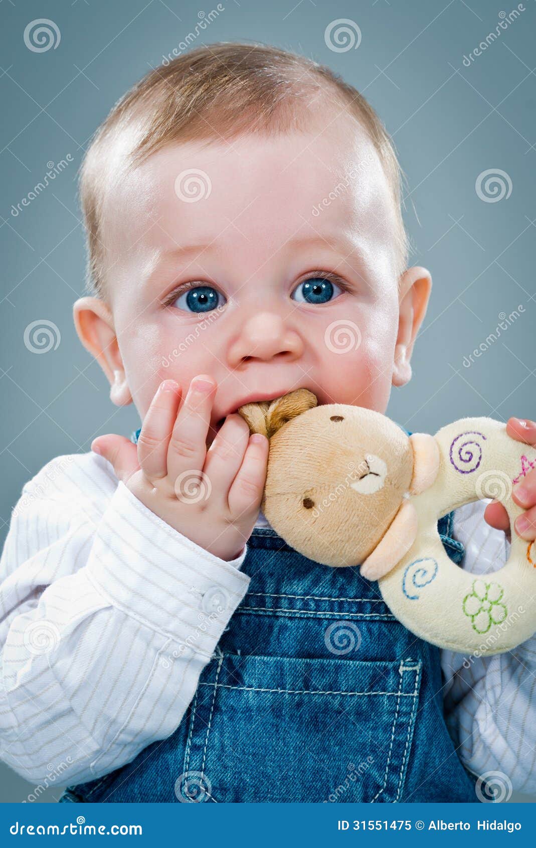Cute Baby Eating a Toy stock image. Image of beauty, little - 31551475