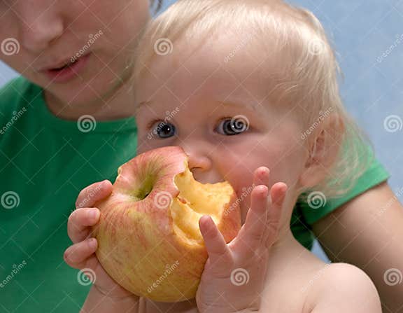 Cute baby eats an apple stock photo. Image of enjoyment - 3702280