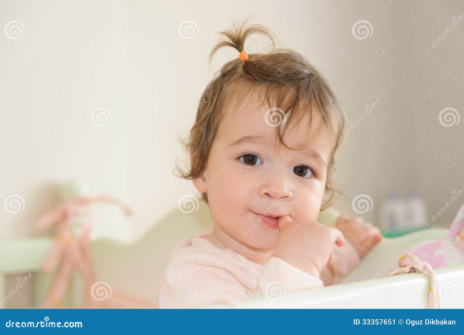 Baby Girl Biting Her Forefinger in Bed Stock Image - Image of face ...