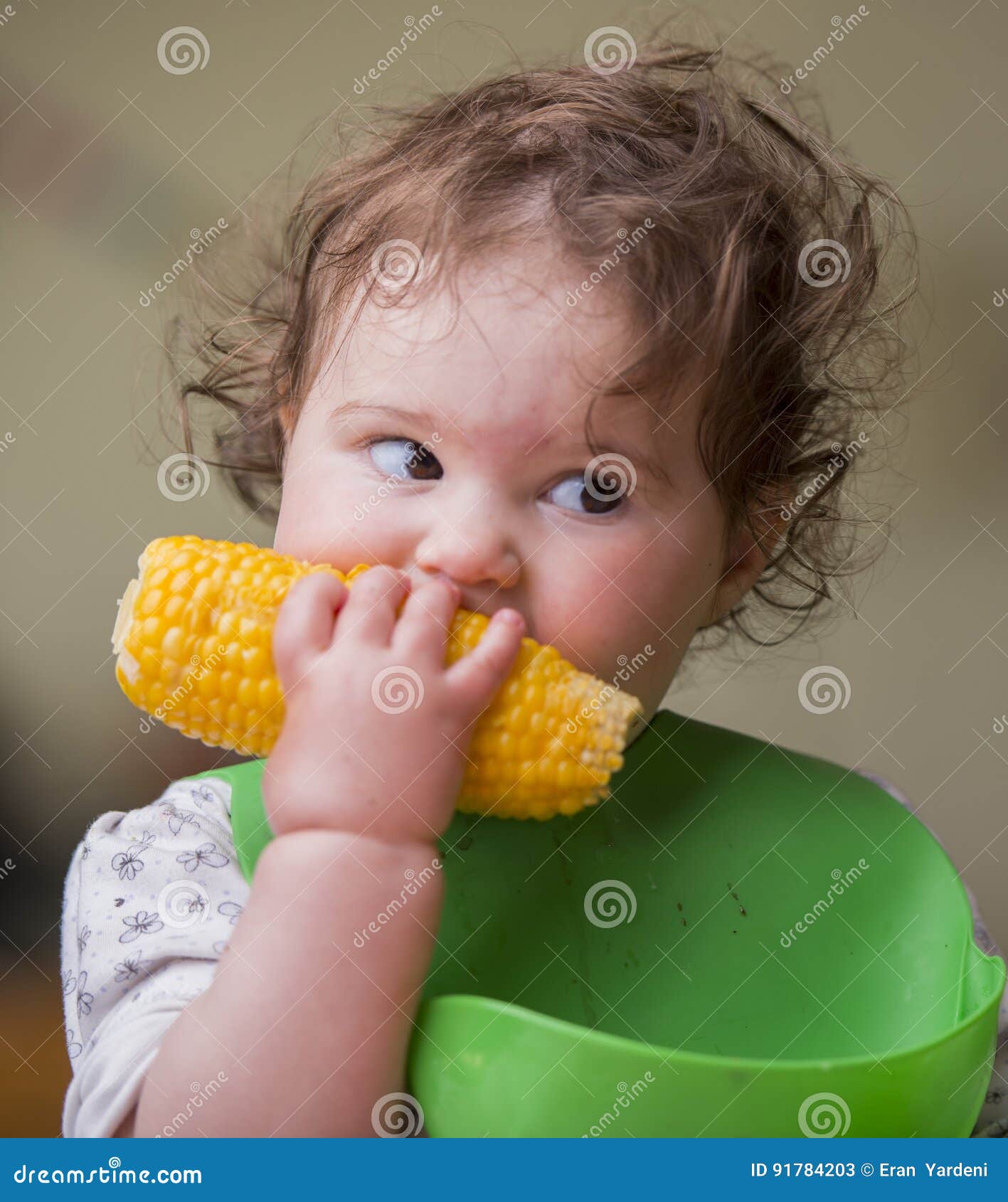 Cute baby girl eating corn stock image. Image of vegetable - 91784203