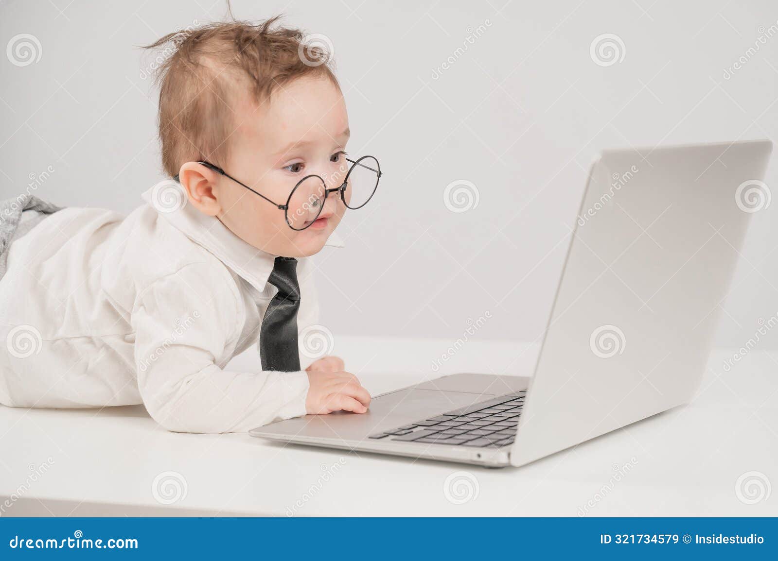 Cute Baby in Glasses and Suit Working on Laptop. Stock Image - Image of ...