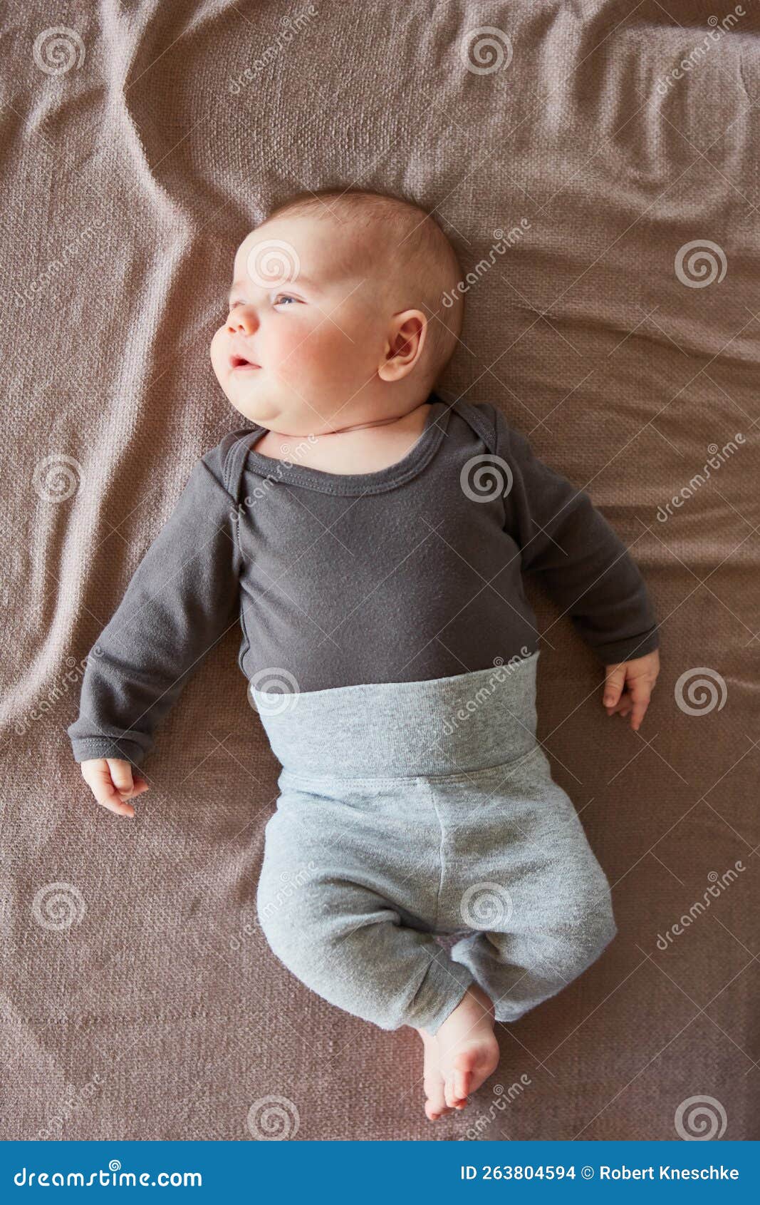 Cute Baby Lies Relaxed on His Back Stock Photo - Image of room, living ...