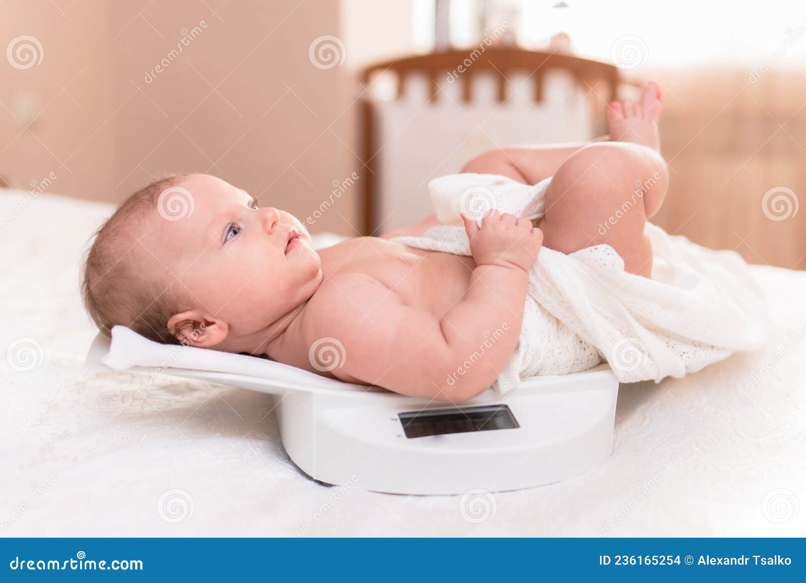 Cute Baby Lying on the Scales in His Bedroom Stock Photo - Image of ...