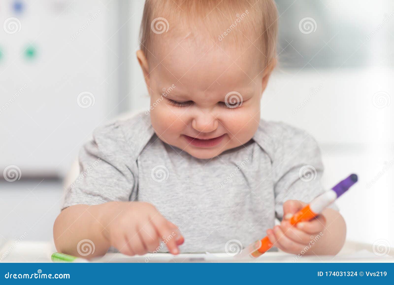 Cute Baby Paint Using Colorful Pencils on White Table Stock Photo ...