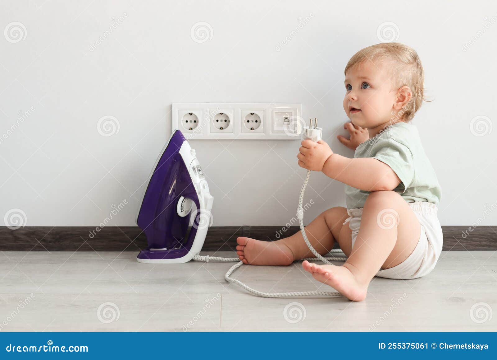 Cute Baby Playing with Electrical Socket and Iron Plug at Home ...