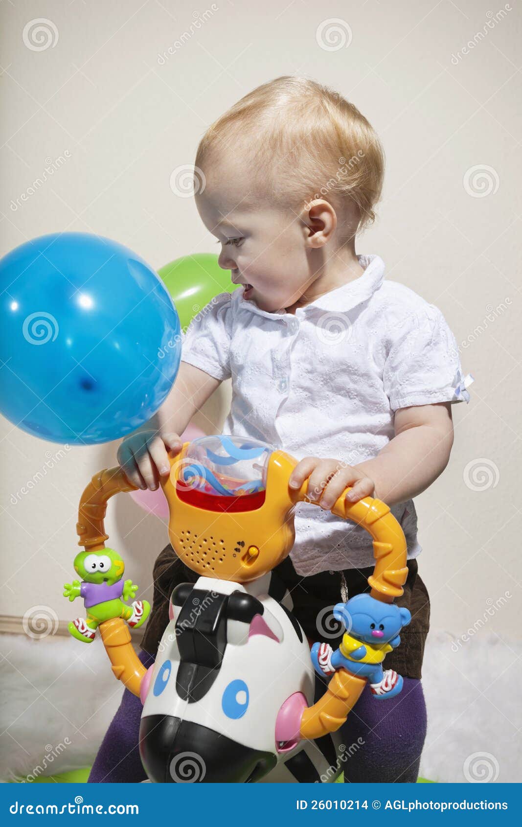 Cute baby riding a new toy stock photo. Image of educational - 26010214
