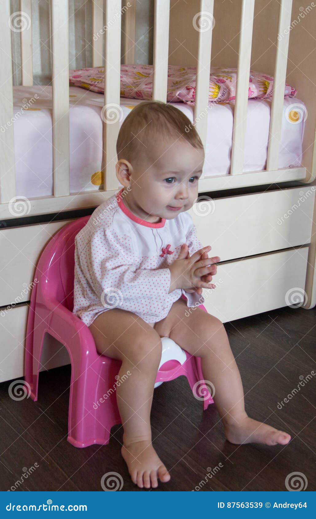Cute baby sitting on a pot stock image. Image of adorable - 87563539