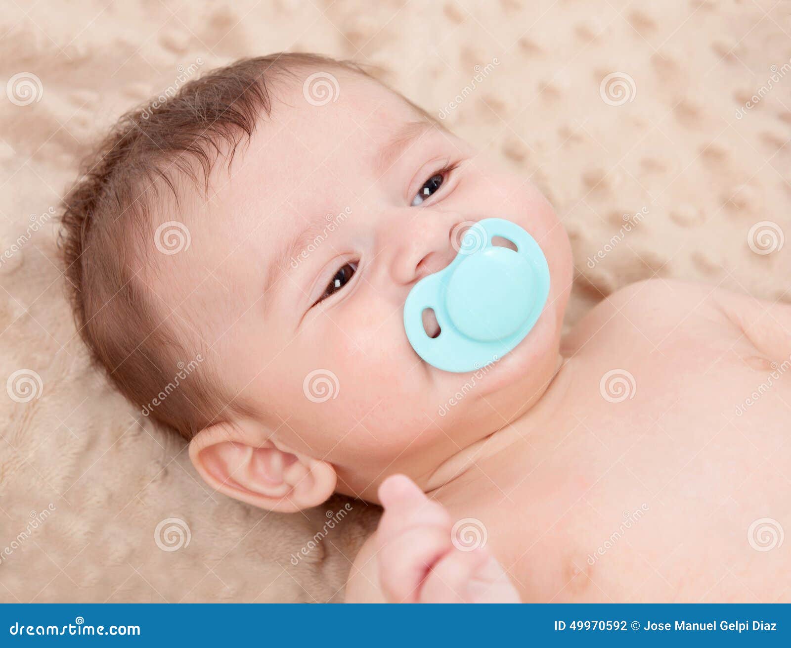 Cute Baby Smiling with Blue Pacifier Stock Photo - Image of looking ...