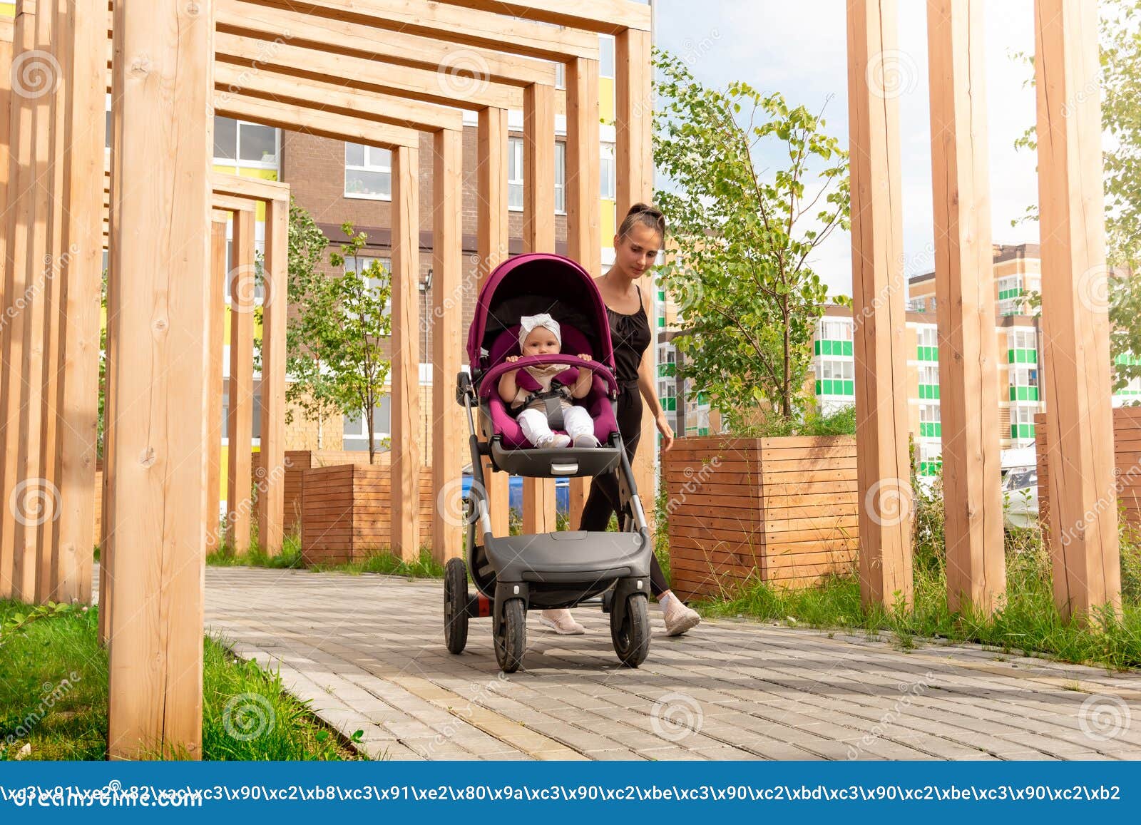 Cute Baby in a Stroller for a Walk with Her Mother Stock Photo - Image ...