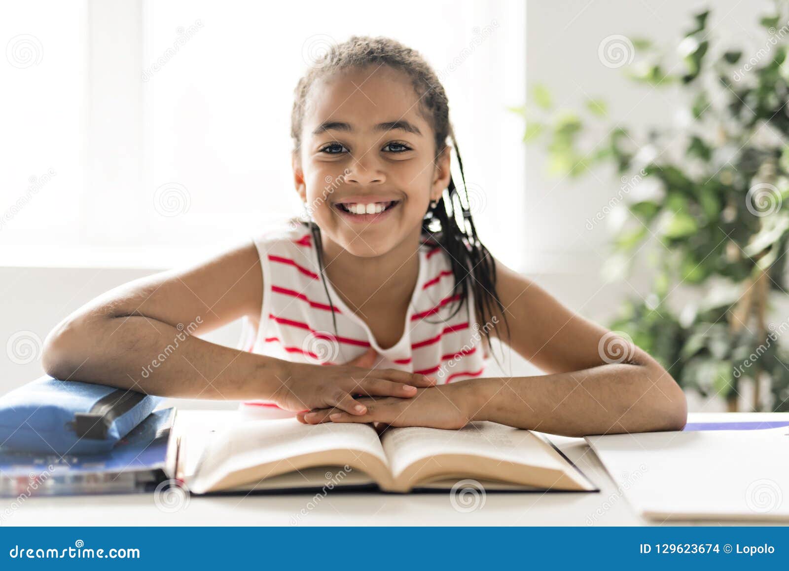 A Cute Black Girl Doing Homework at Home Stock Photo - Image of busy ...
