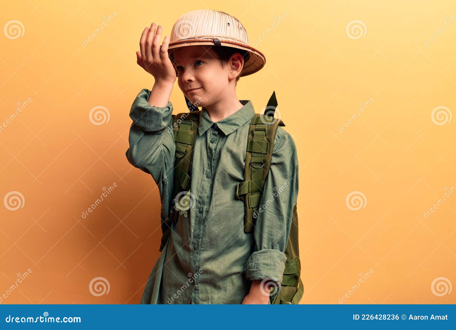 Cute Blond Kid Wearing Explorer Hat and Backpack Surprised with Hand on ...