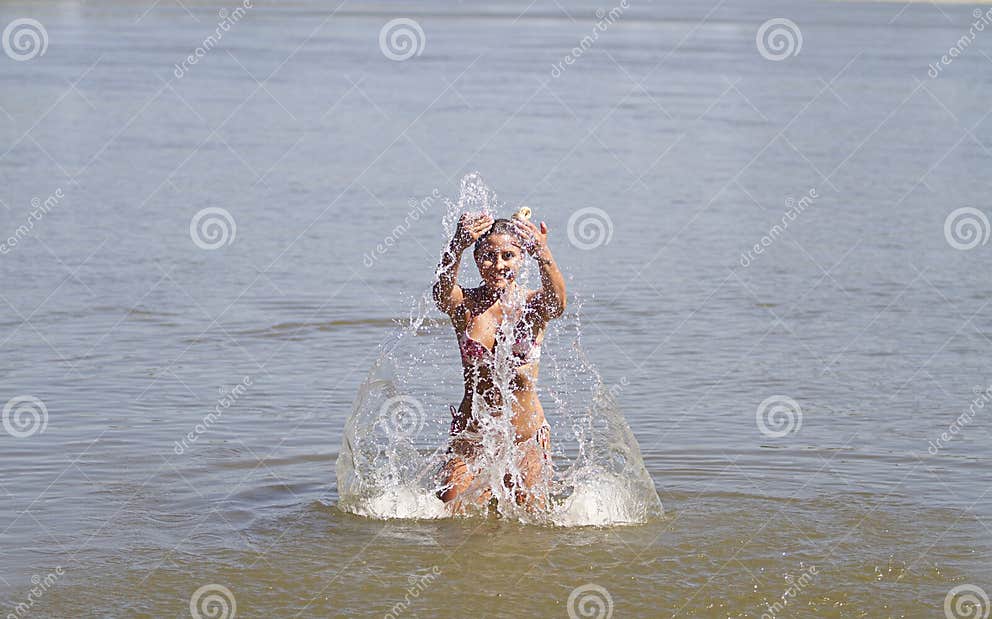 Cute Blonde in a Bikini.in the Water.it is Sprayed with Water.. Stock ...