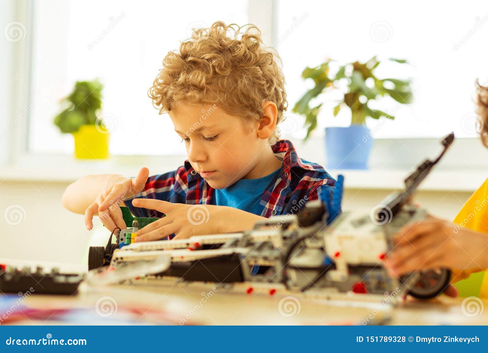 Cute Blonde Boy Concentrating on His Task Stock Photo - Image of pupil ...