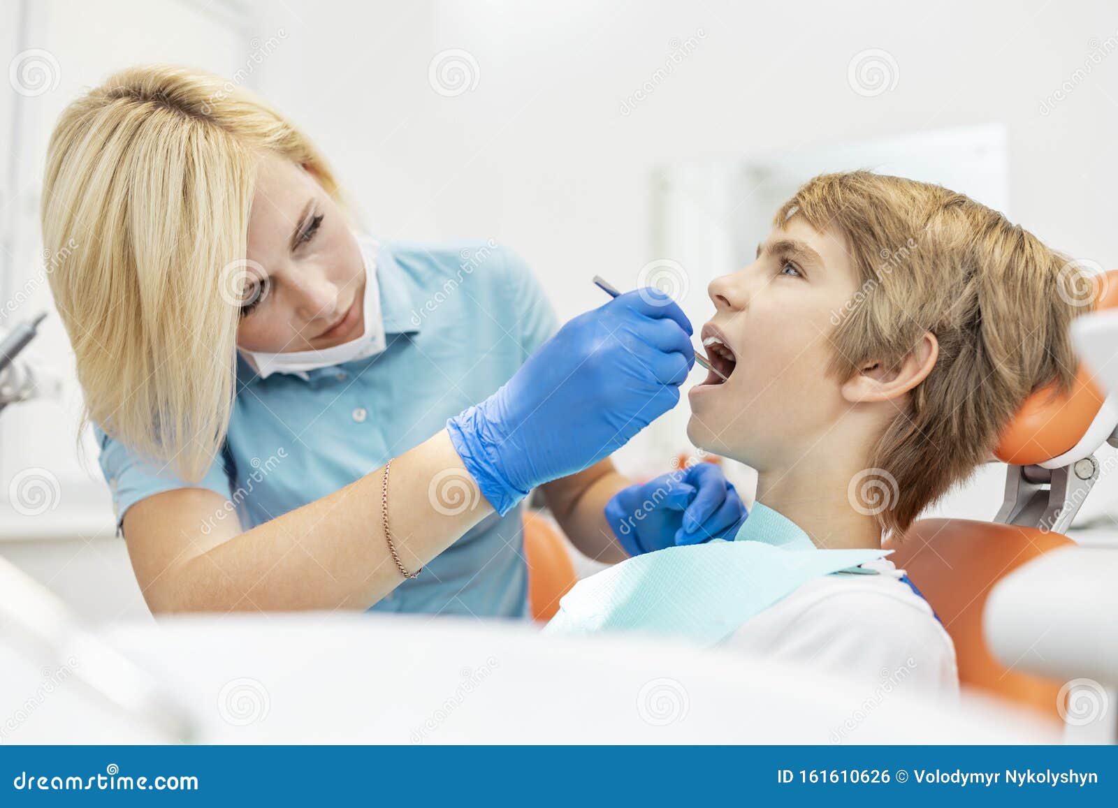 Dentist Examining the Young Patient`s Mouth Stock Photo - Image of ... Dentist Examining the Young Patient`s Mouth Stock Photo - Image of ...