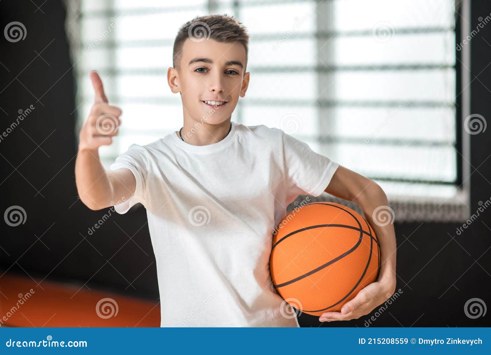 A Cute Boy with a Ball Looking Contented Stock Image - Image of ...
