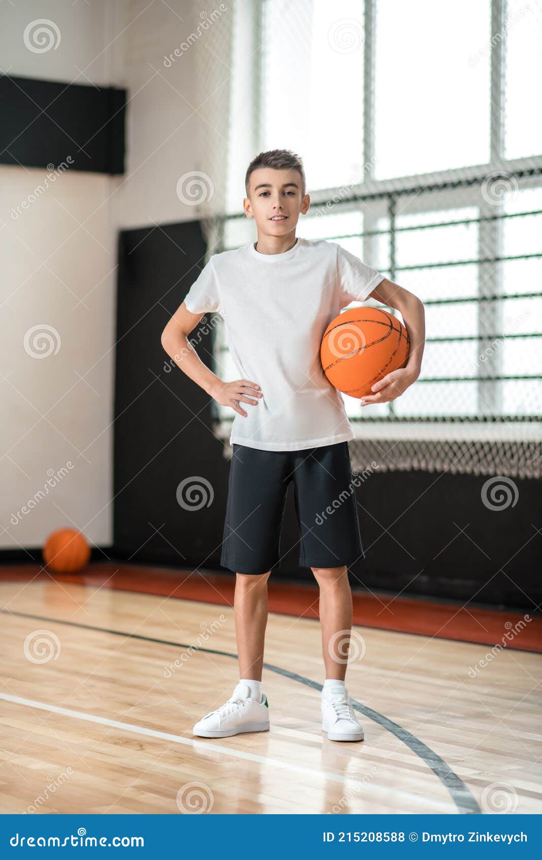A Cute Boy with a Ball Looking Contented Stock Photo - Image of ...