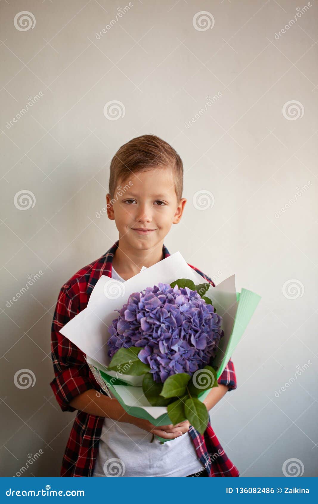Cute Boy with a Beautiful Bouquet of Flowers Hydrangea Stock Photo ...
