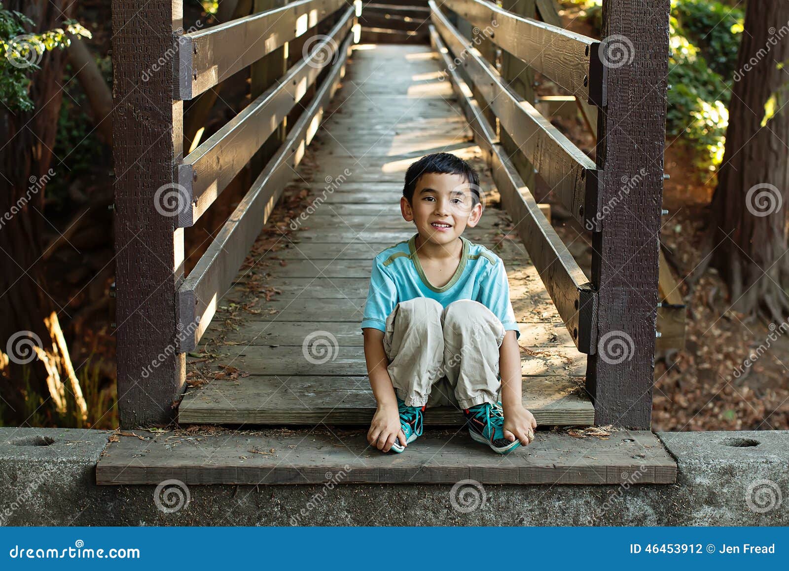 Cute boy on a bridge stock photo. Image of black, young - 46453912