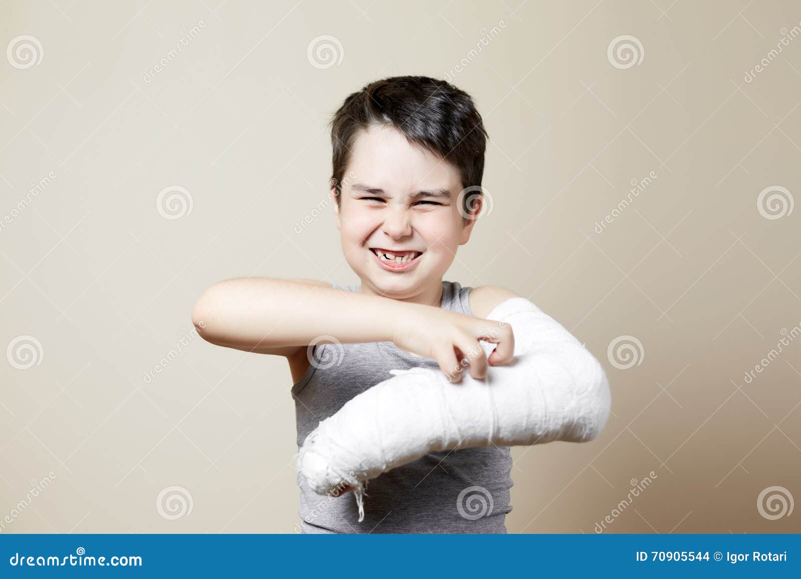 Cute boy with broken arm stock photo. Image of face, football - 70905544