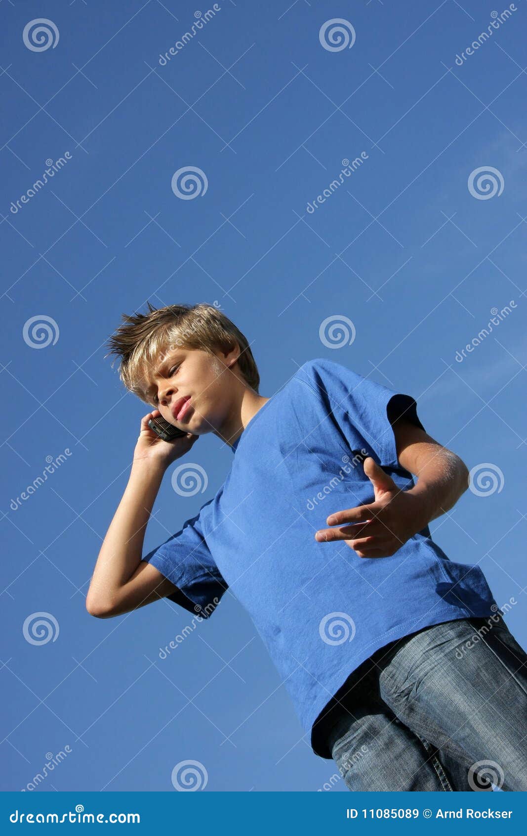 Cute Boy Discussing on His Cell Phone Stock Image - Image of cell, eyes ...