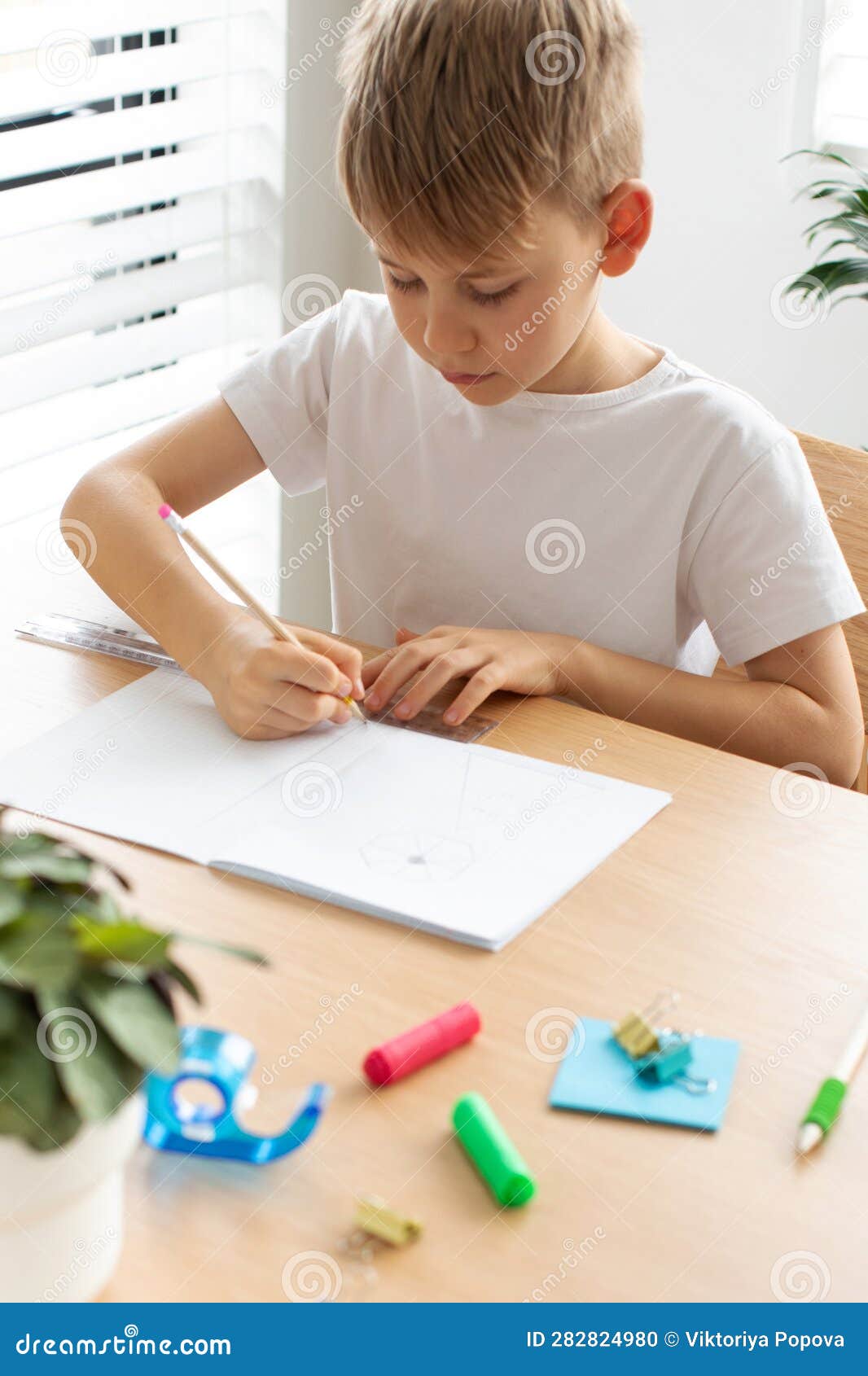 Cute Boy Doing School Assignments at Home. the Concept of Home ...