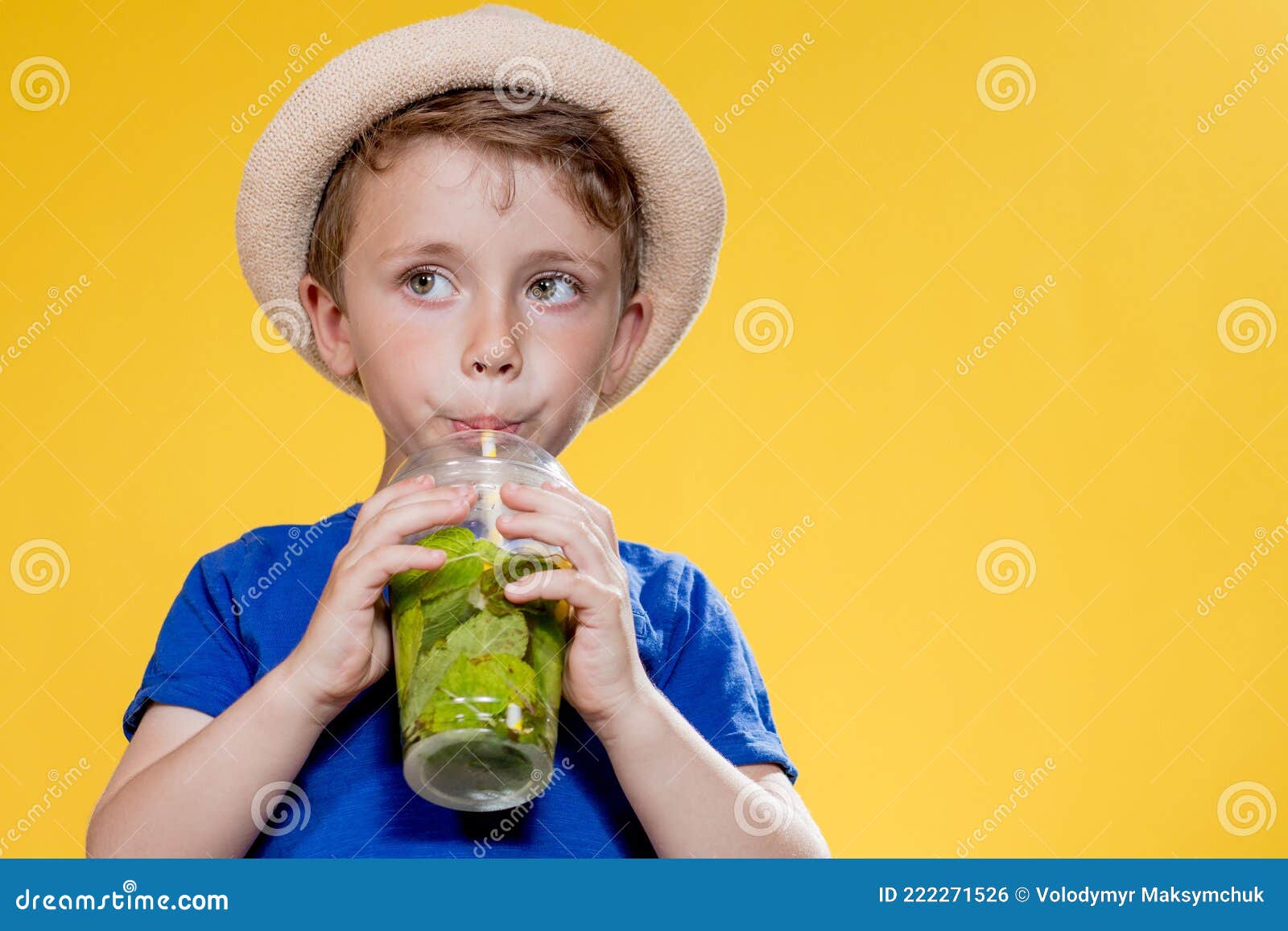 Cute Boy Drink Mojito Cocktail from Plastic Cup Over Yellow Studio ...