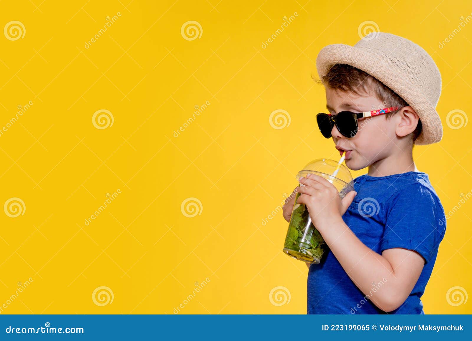 Cute Boy Drink Mojito Cocktail from Plastic Cup Over Yellow Studio ...