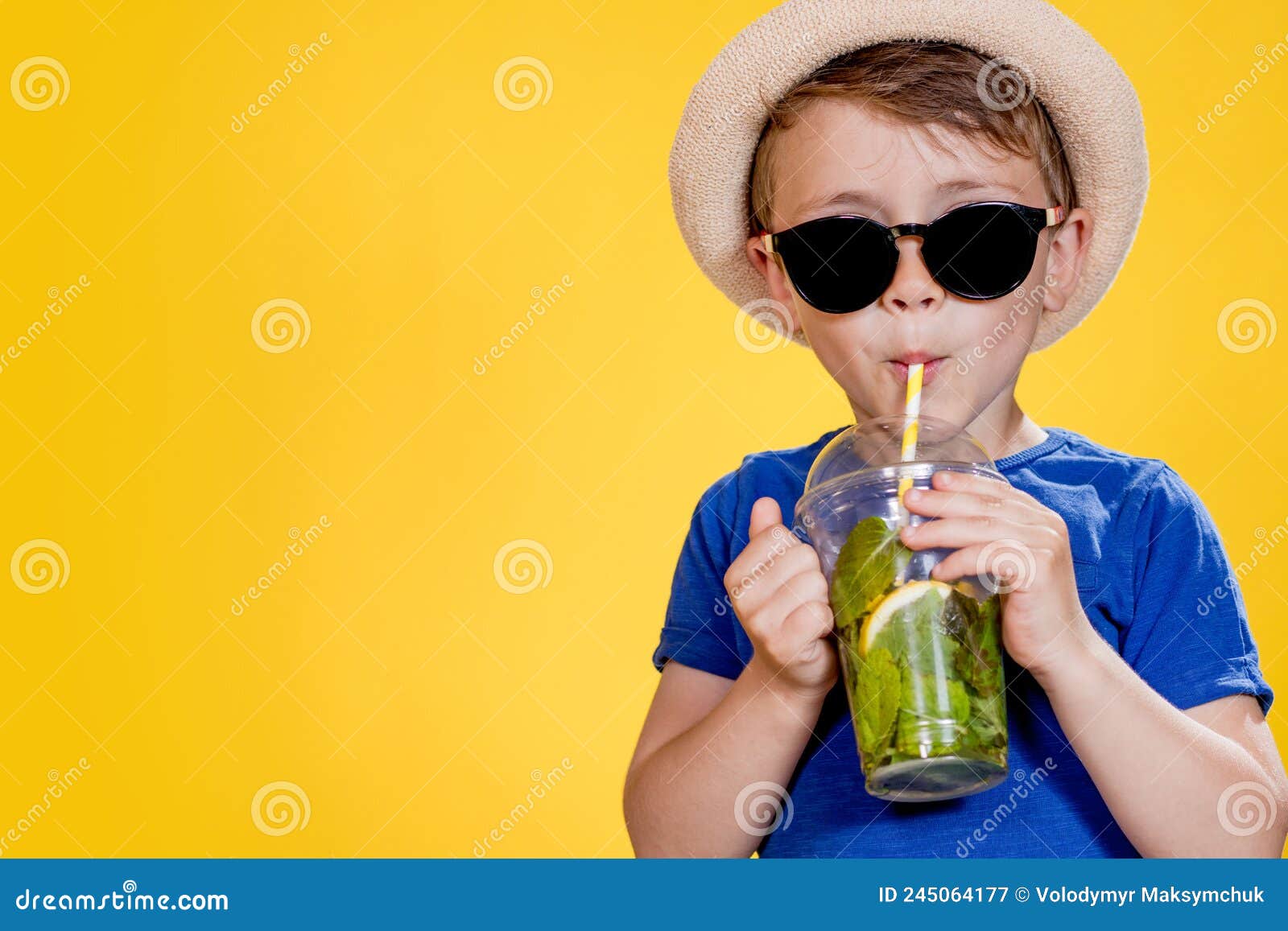Cute Boy Drink Mojito Cocktail from Plastic Cup Over Yellow Studio ...