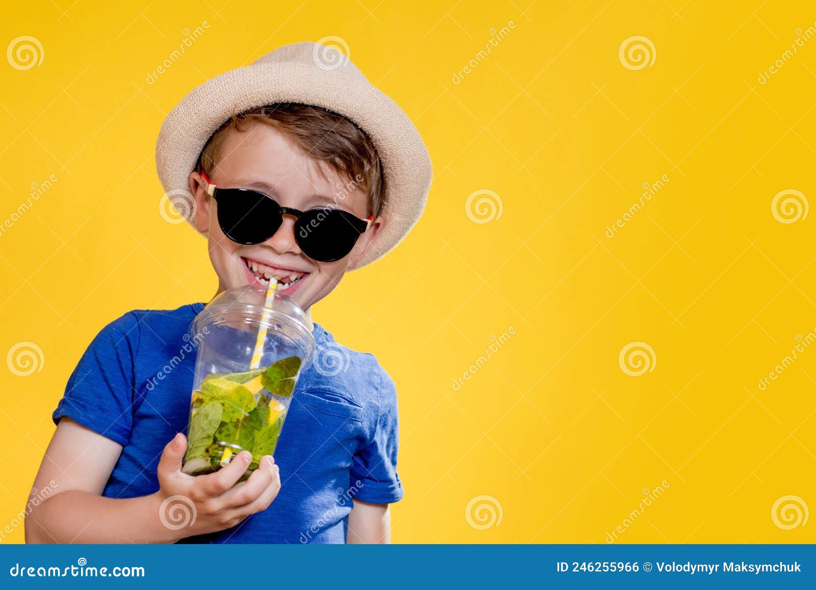 Cute Boy Drink Mojito Cocktail from Plastic Cup Over Yellow Studio ...