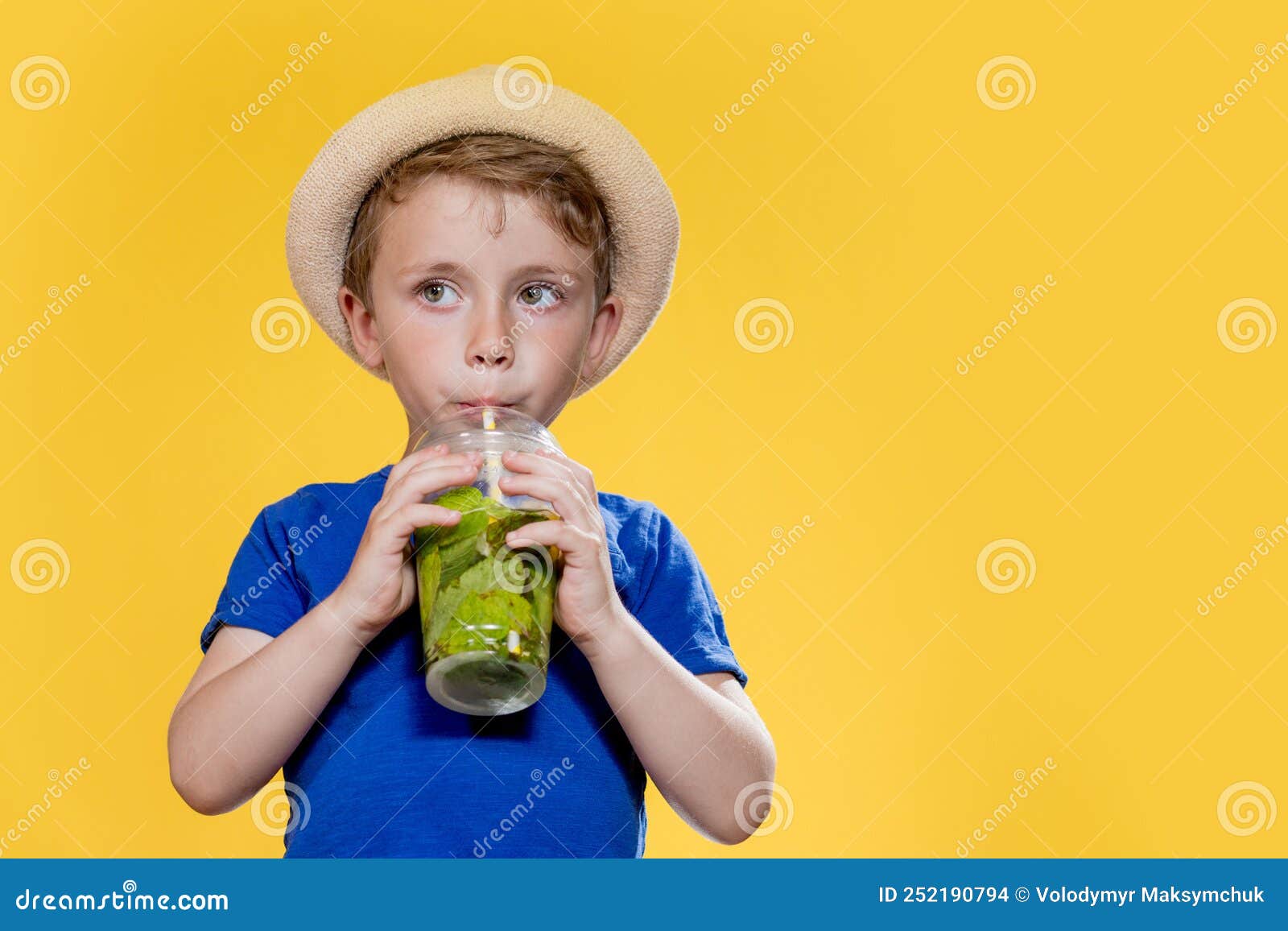 Cute Boy Drink Mojito Cocktail from Plastic Cup Over Yellow Studio ...