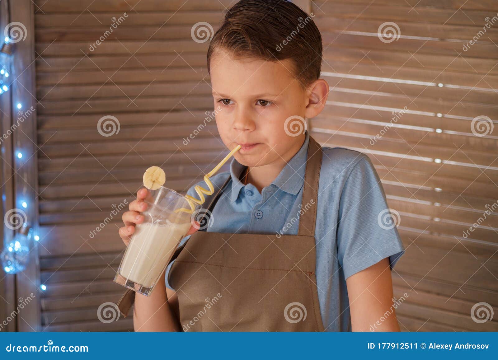 A Cute Boy Drinks a Milkshake with a Banana Stock Image - Image of ...