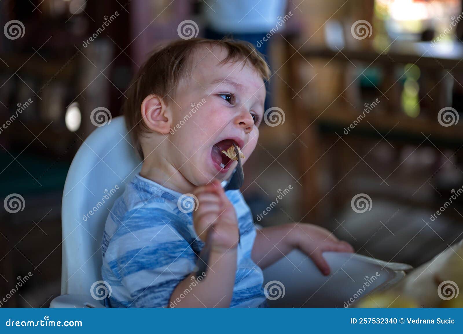 Cute Boy Eating Meat Using Fork Stock Photo - Image of human, mouth ...