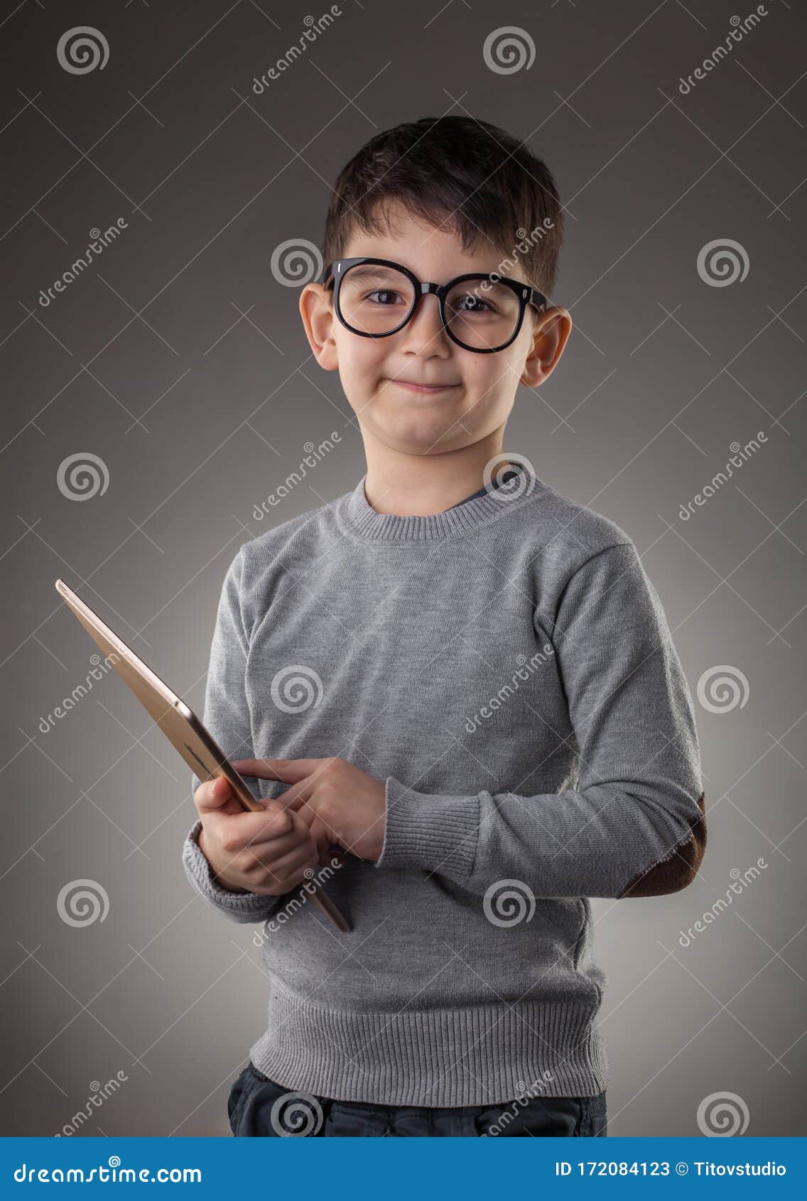 Cute Boy with Electronic Tablet on the Gray Background Stock Image ...