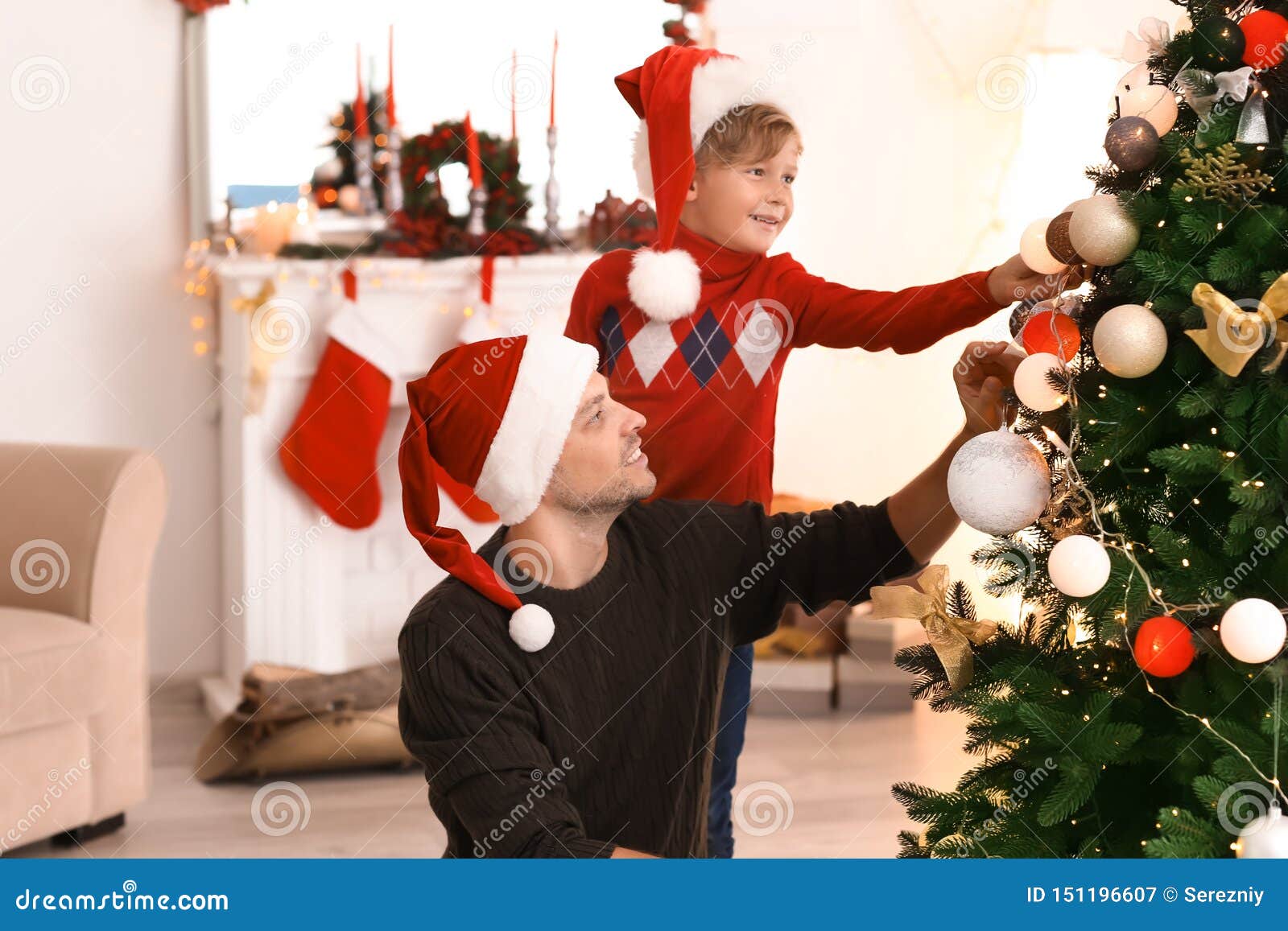 Cute Boy with Father Decorating Christmas Tree in Room Stock Image ...