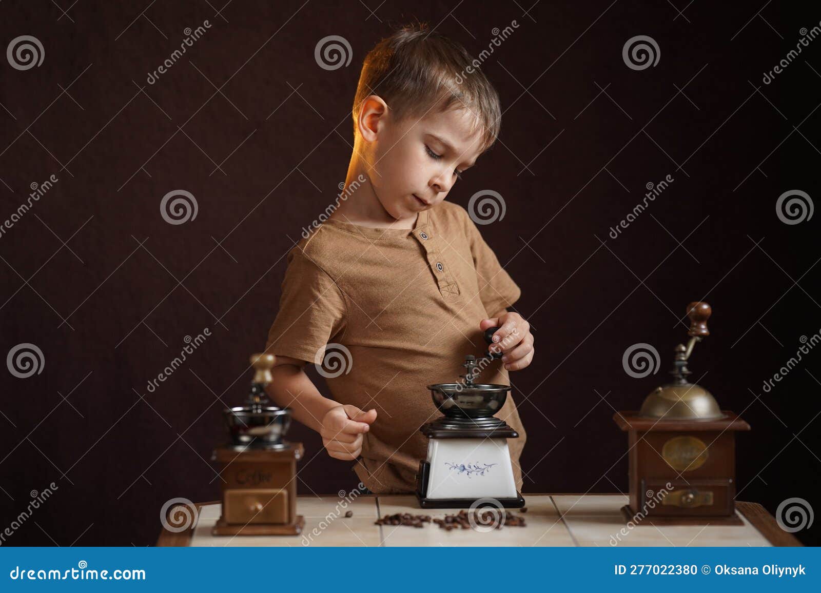 Cute Boy Grinding Coffee on a Retro Coffee Grinder. Stock Photo - Image ...