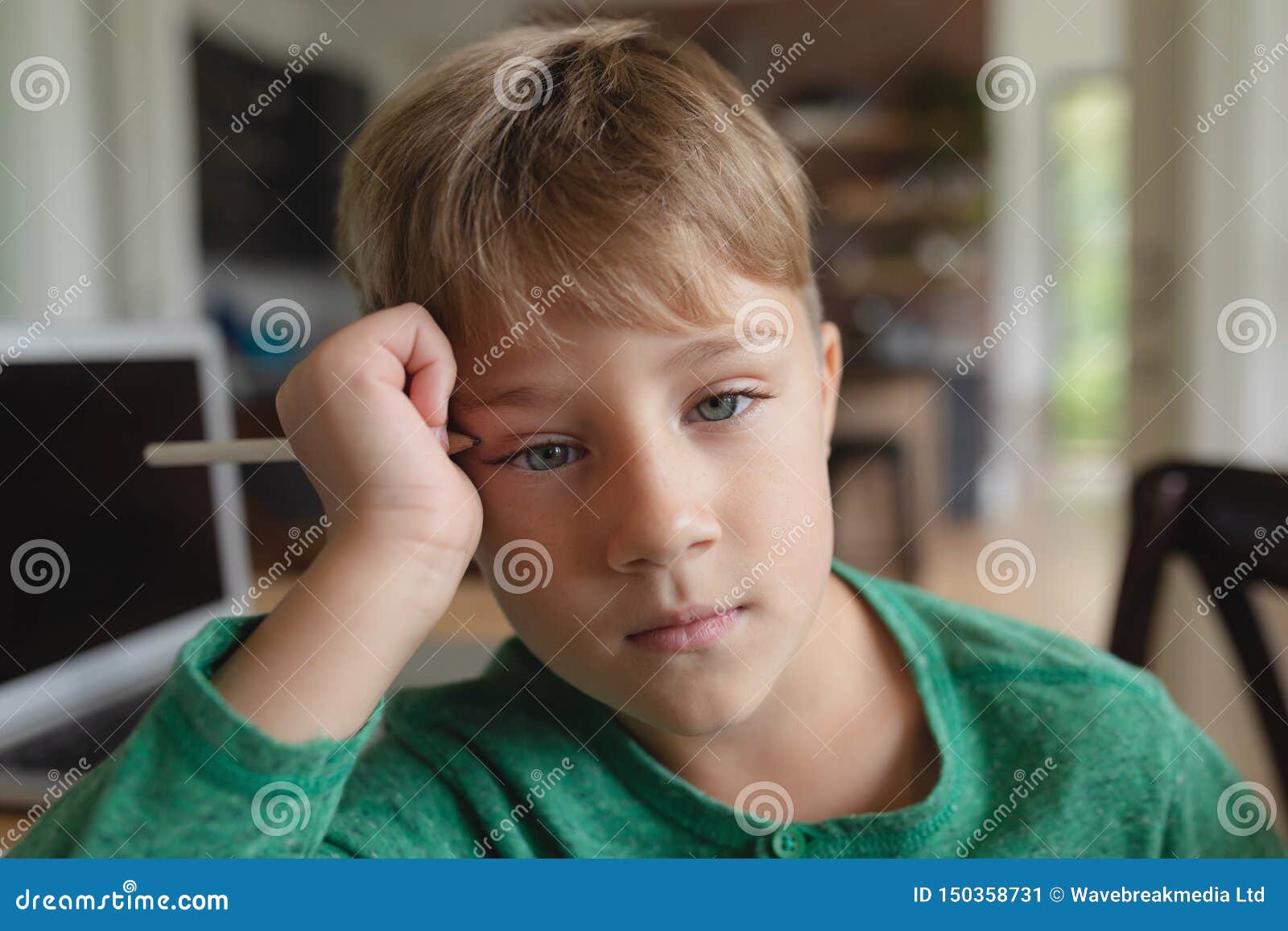 Cute Boy with Hand on Head Looking at Camera in a Comfortable Home ...